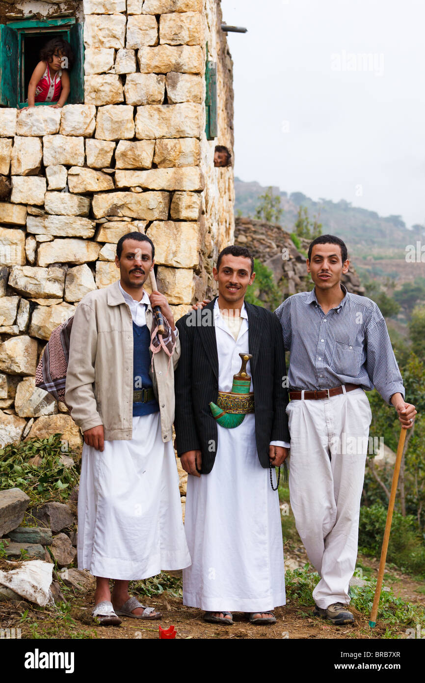 Three Yemeni men outside a house in Al Hajjarah, Haraz Mountains, Yemen ...
