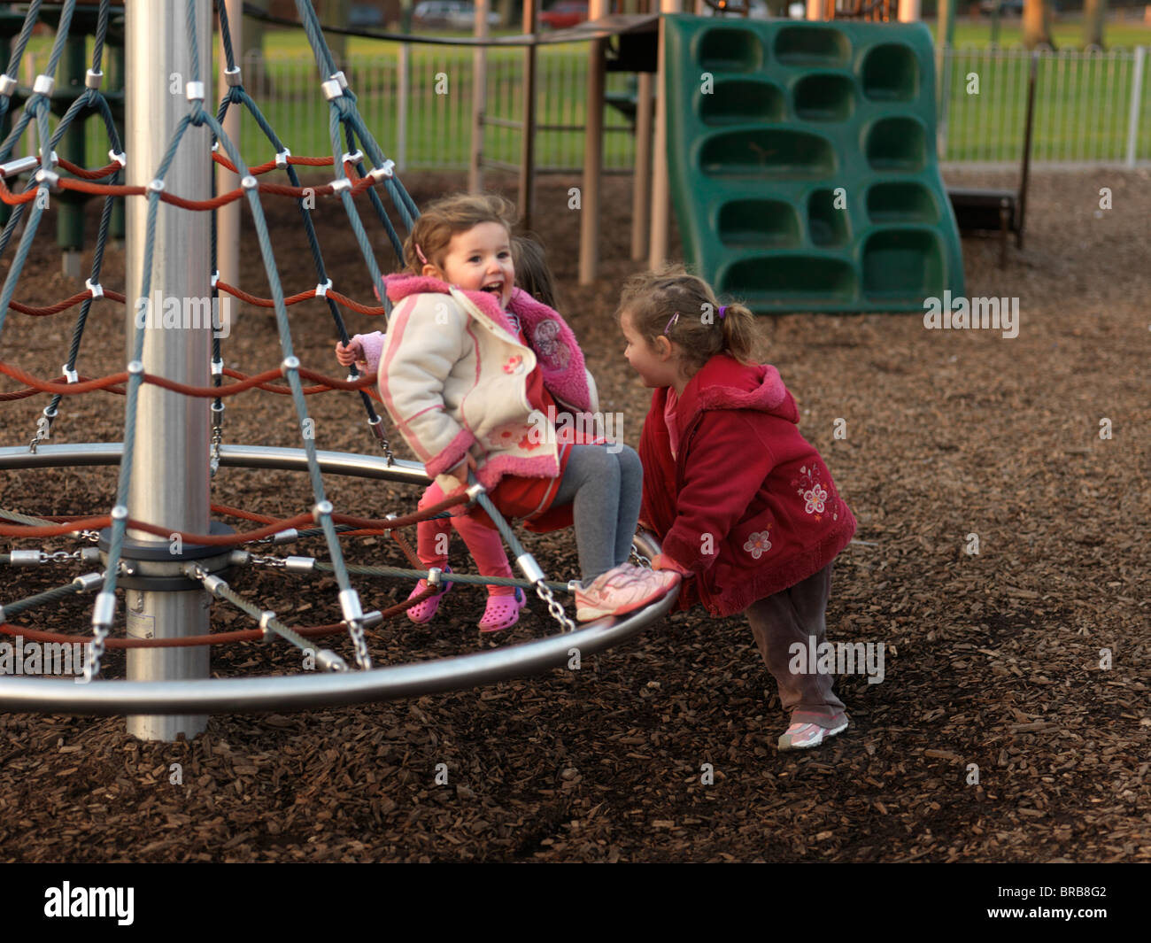 Girls on roundabout hi-res stock photography and images - Alamy