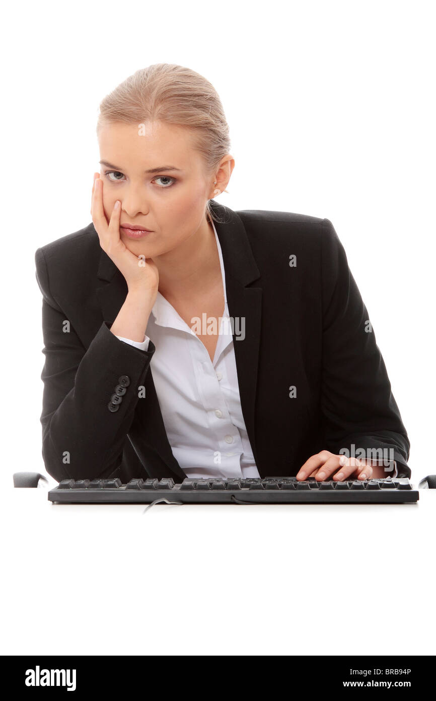 Bored businesswoman working on pc, isolated on white background Stock ...
