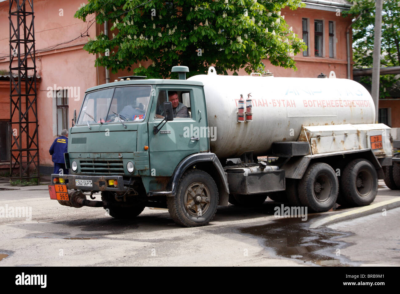 Old soviet MAZ truck (lorry) carries cargo of liquefied petroleum gas ...