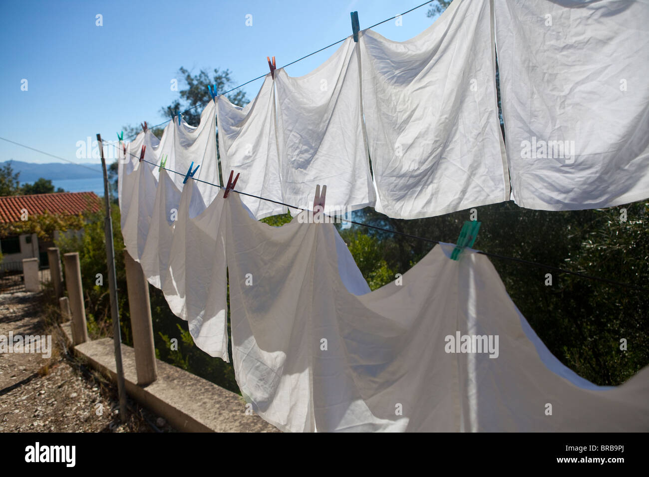 Napkins drying on washing line, Paxos, Greece Stock Photo - Alamy