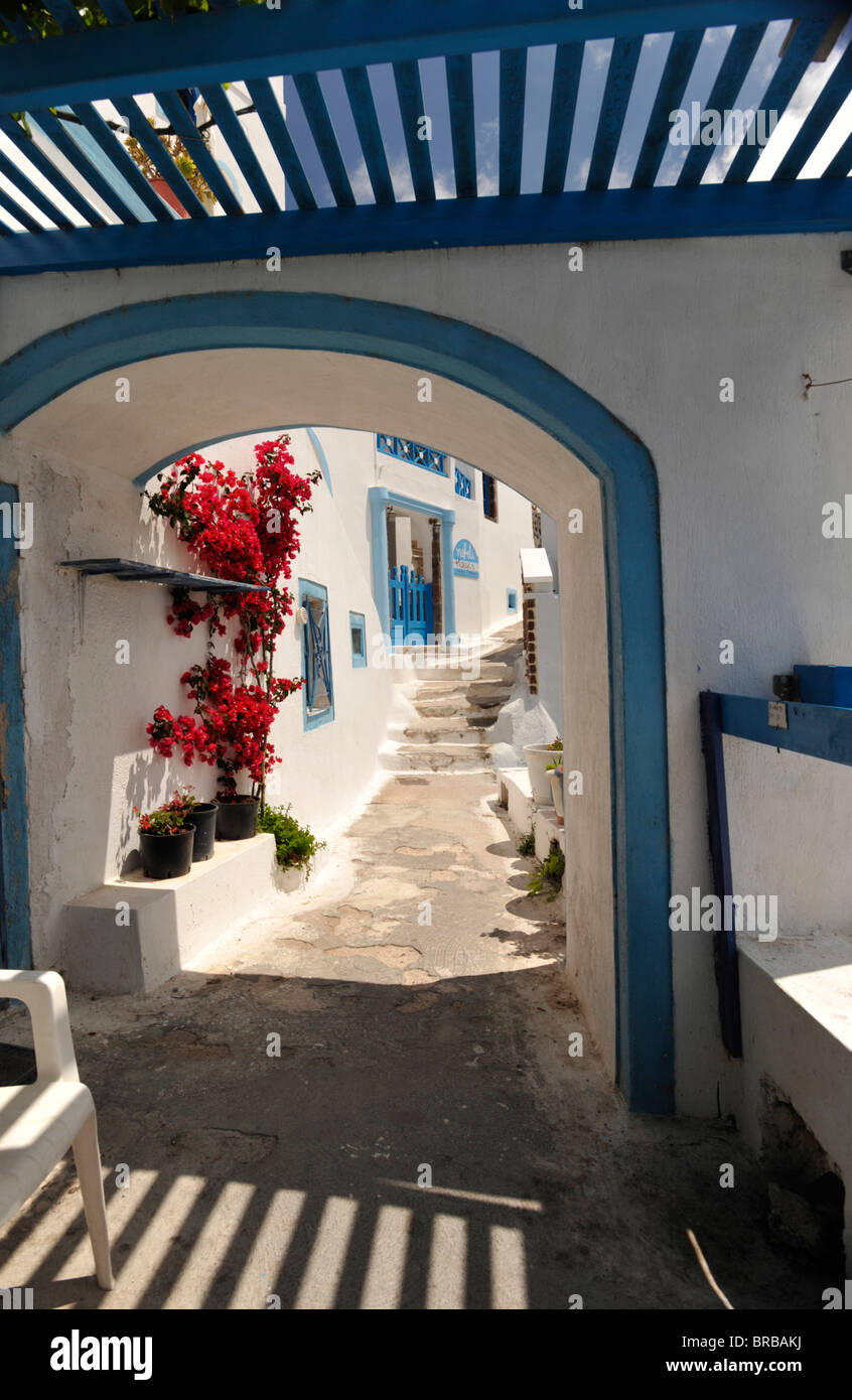 Looking through an archway in a village on the Greek island of ...