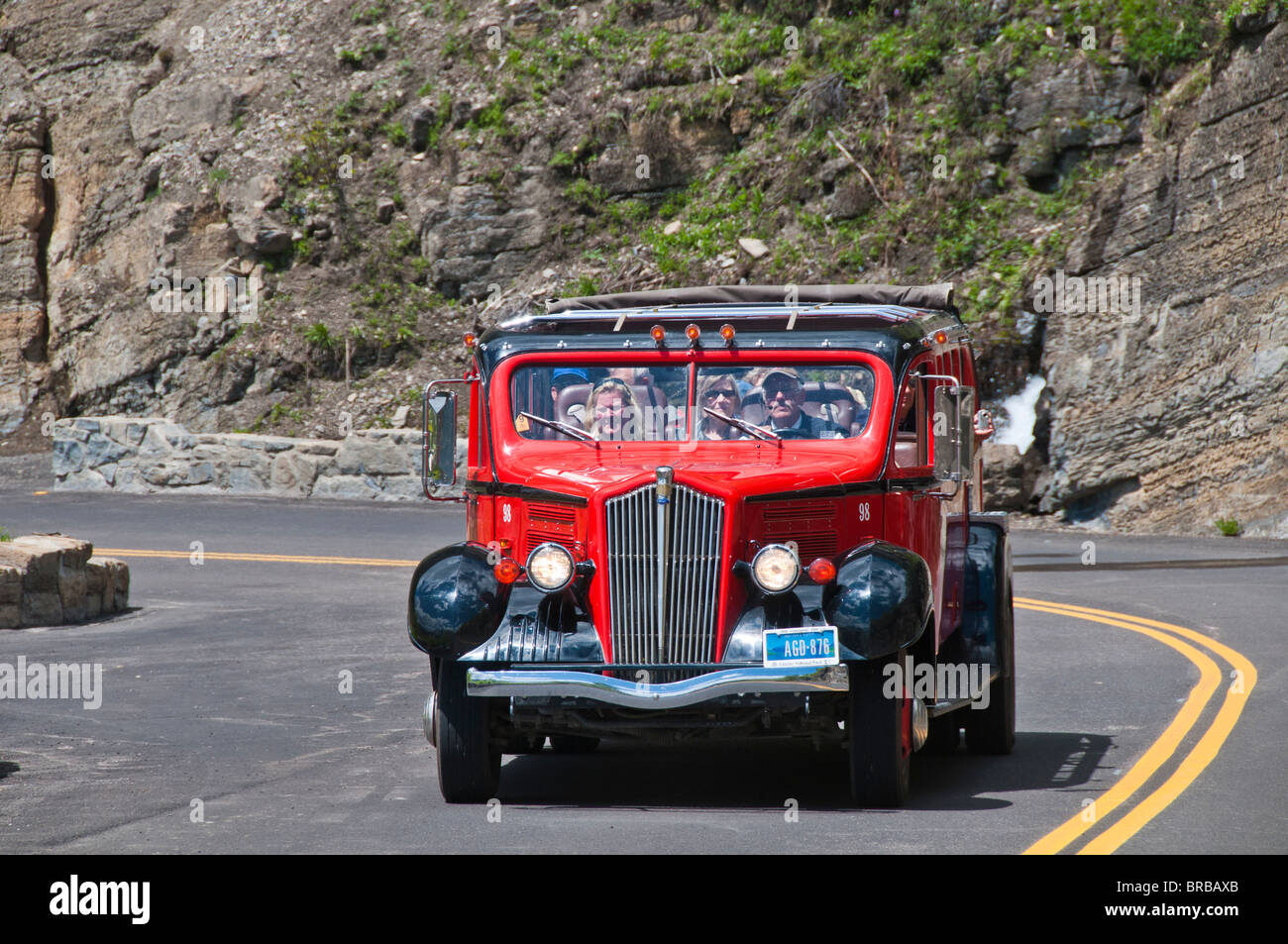Red bus on the Going-to-the-Sun Road, Glacier National Park, Montana ...