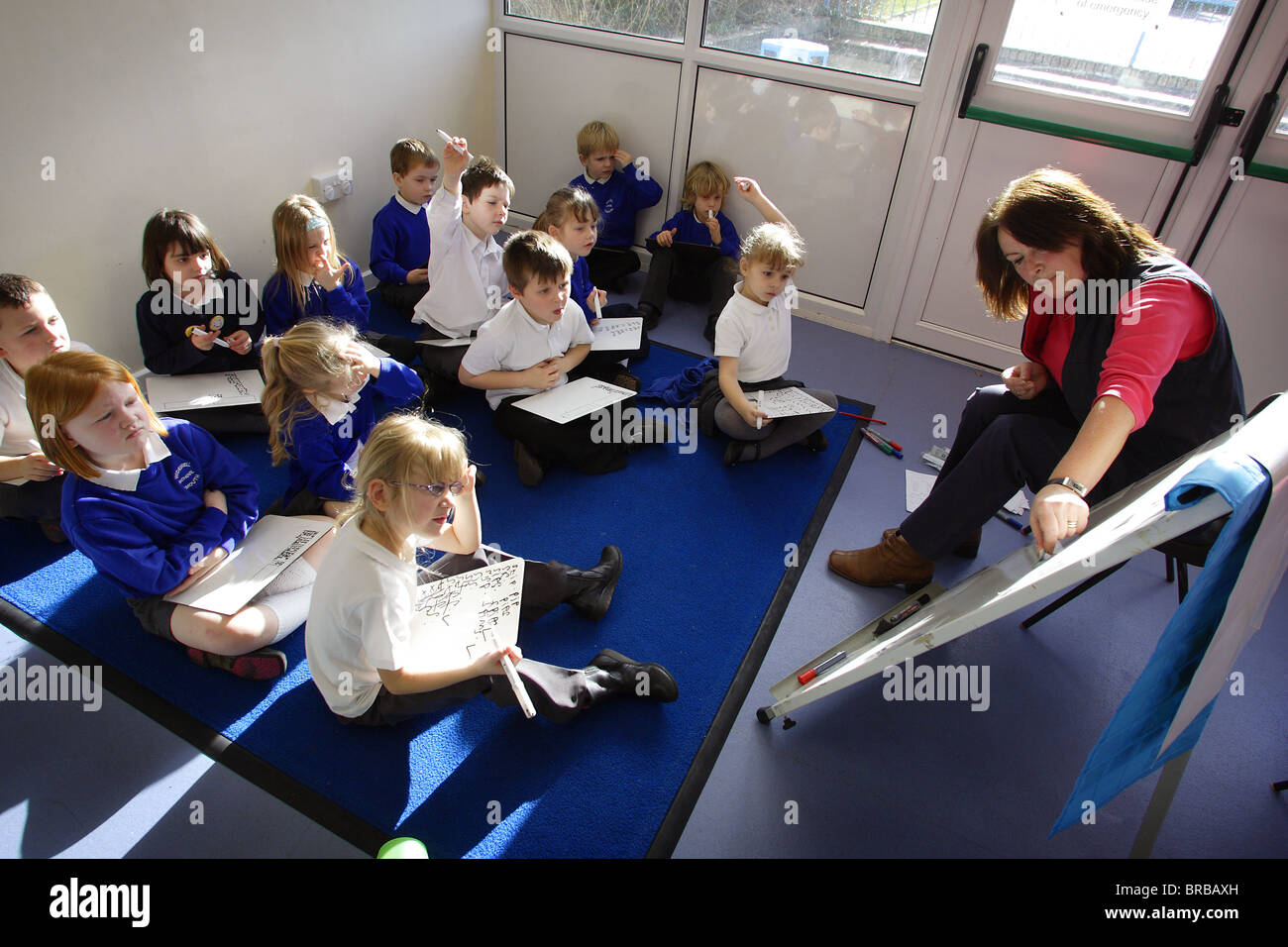 Phonics reading classes at a primary school in Devon, UK Stock Photo ...