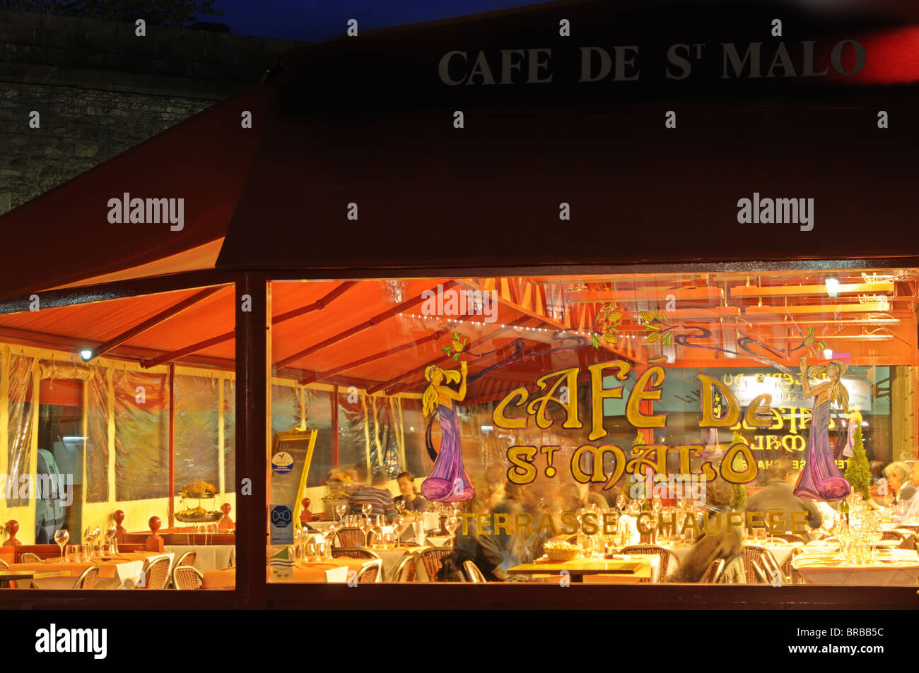 A lit restaurant at night Stock Photo - Alamy