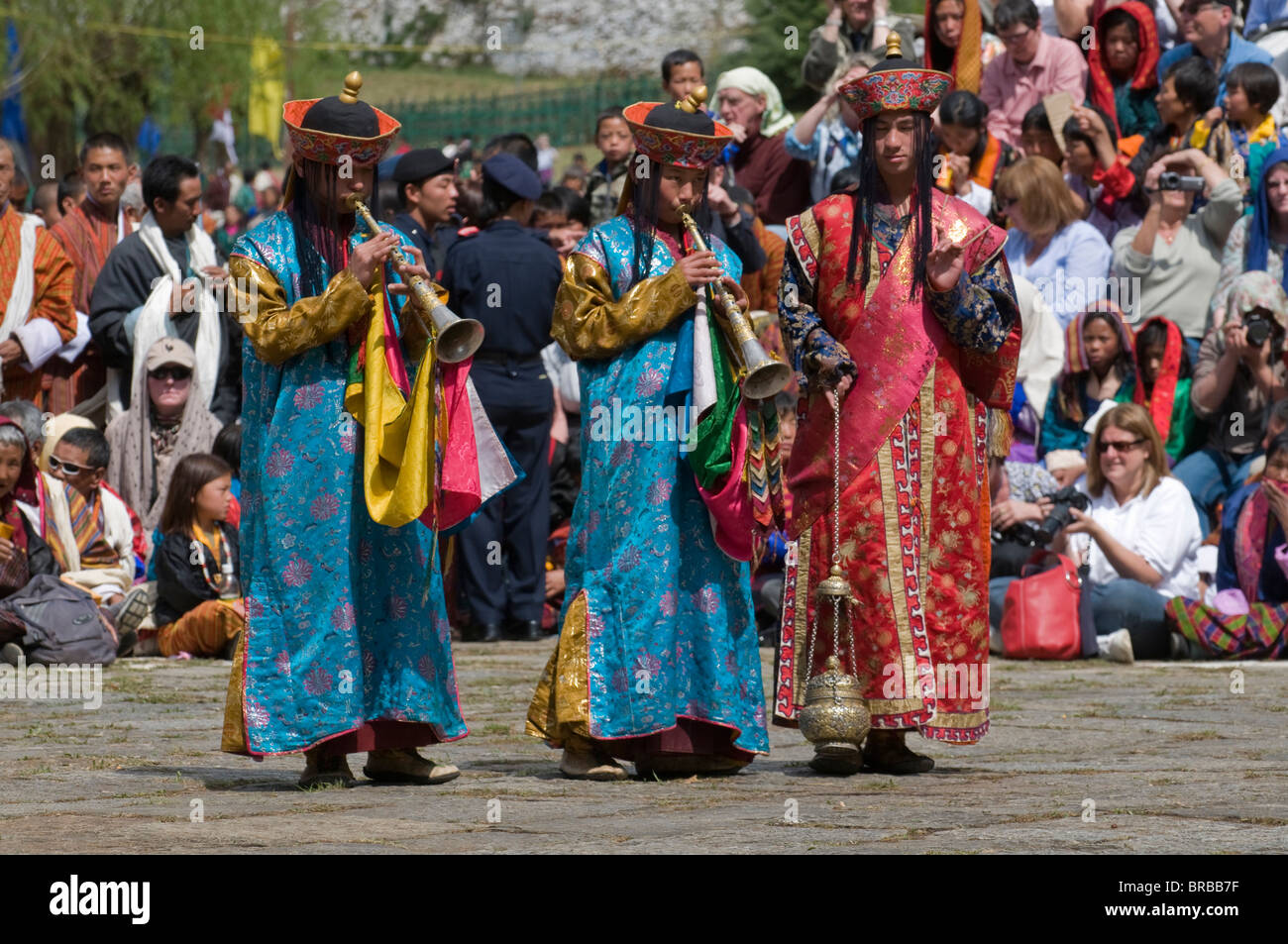 Buddhists playing the flute at religious festivity, Paro Tsechu, Paro ...