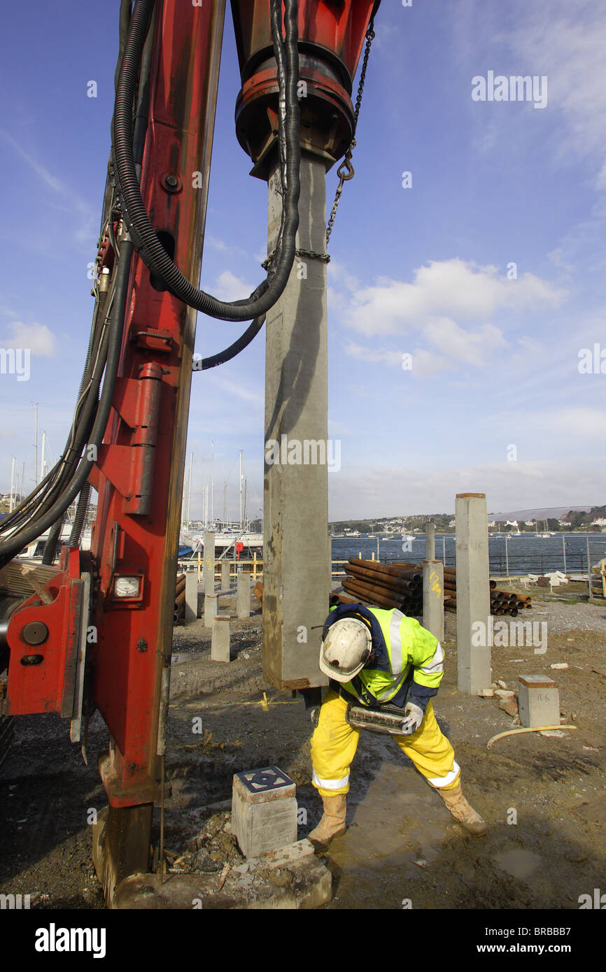 Foundation piles being installed Stock Photo - Alamy
