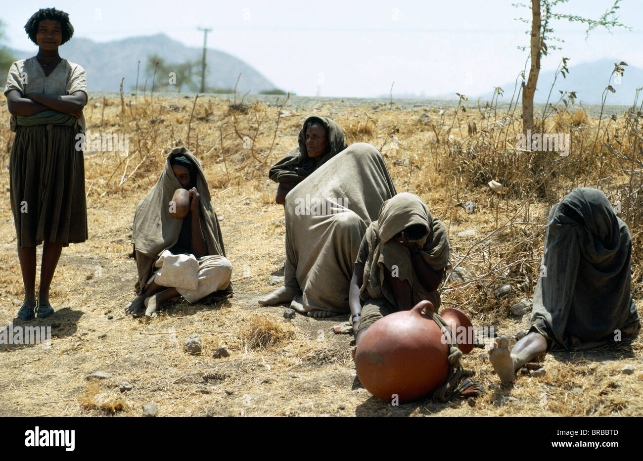 ETHIOPIA North East Africa Group of drought famine victims sitting in ...