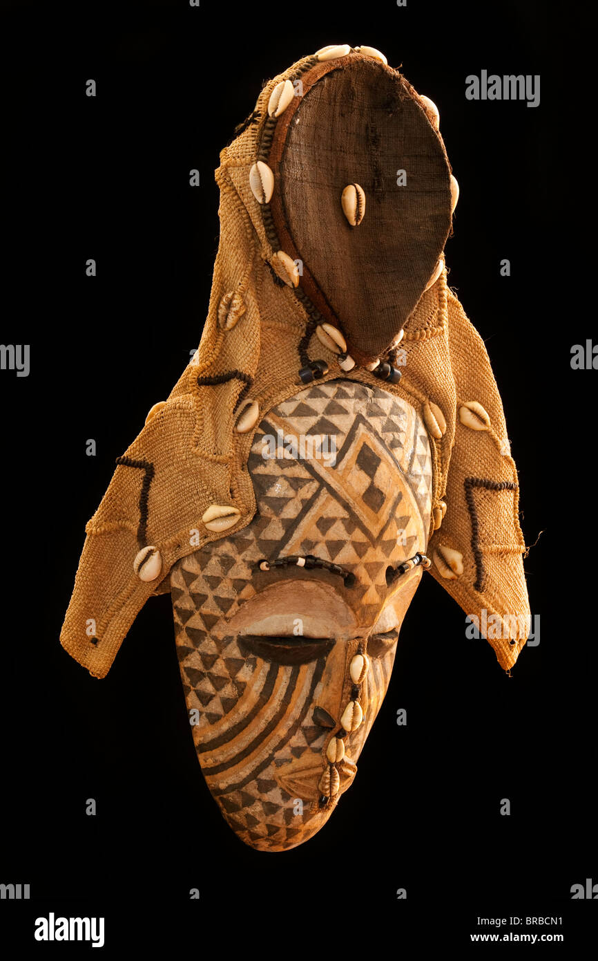 Wooden carved African tribal mask, shoot from the top, dark wood with ...