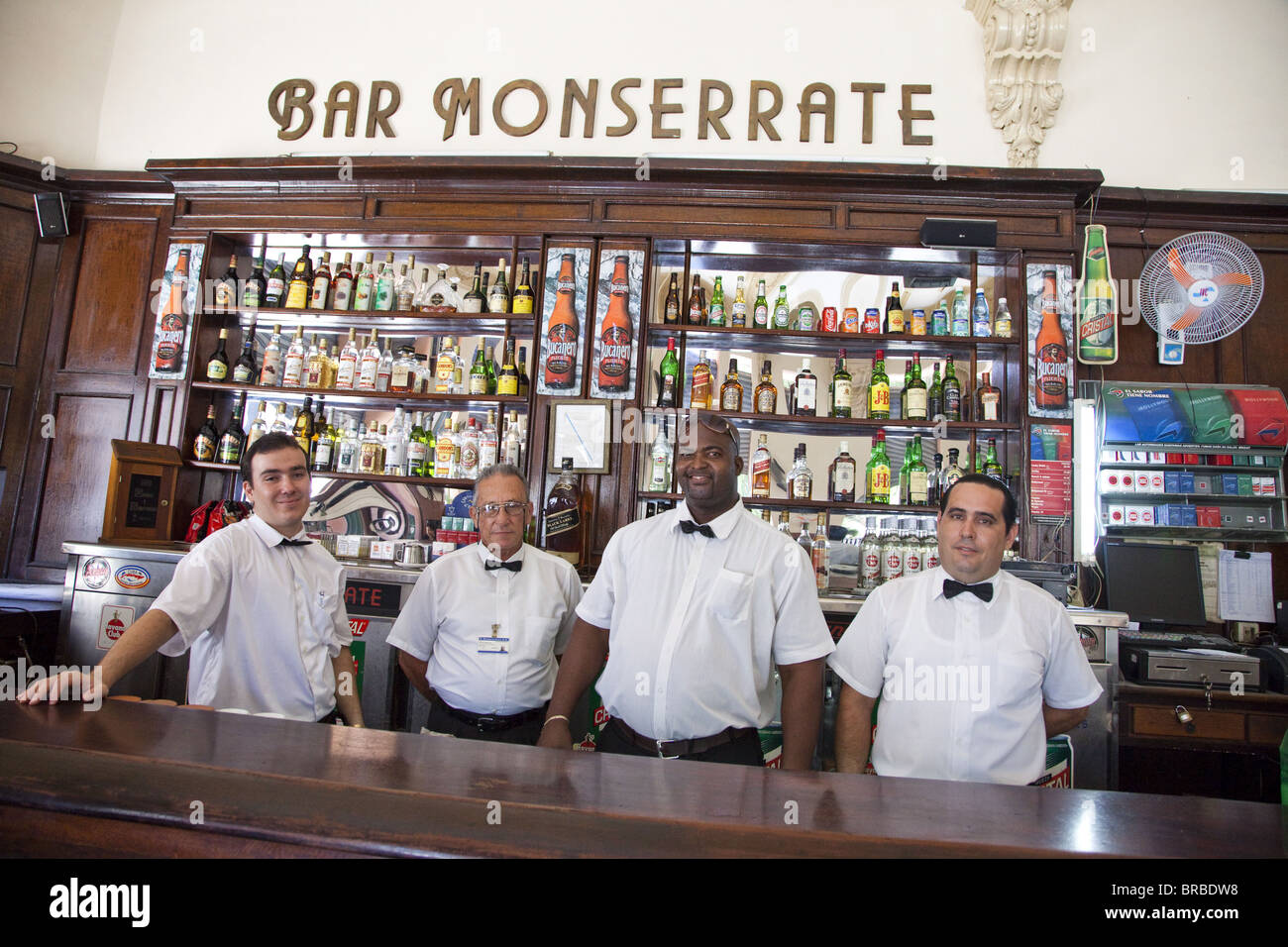 Bartenders and waiters at the Monserrate Bar in Central Havana, Havana ...