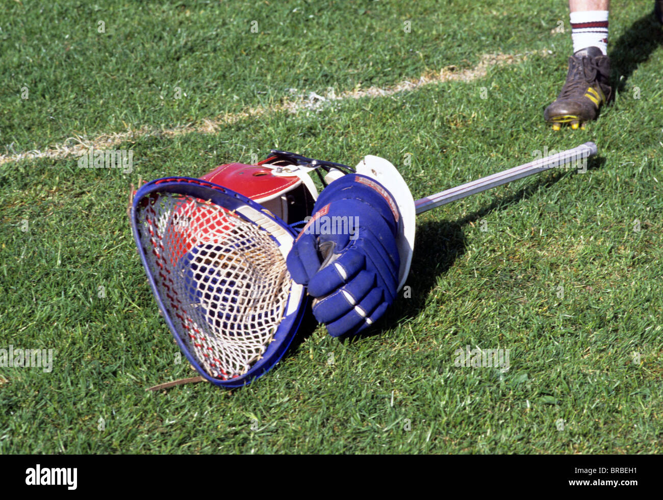 Lacrosse equipment sitting on a field Stock Photo - Alamy