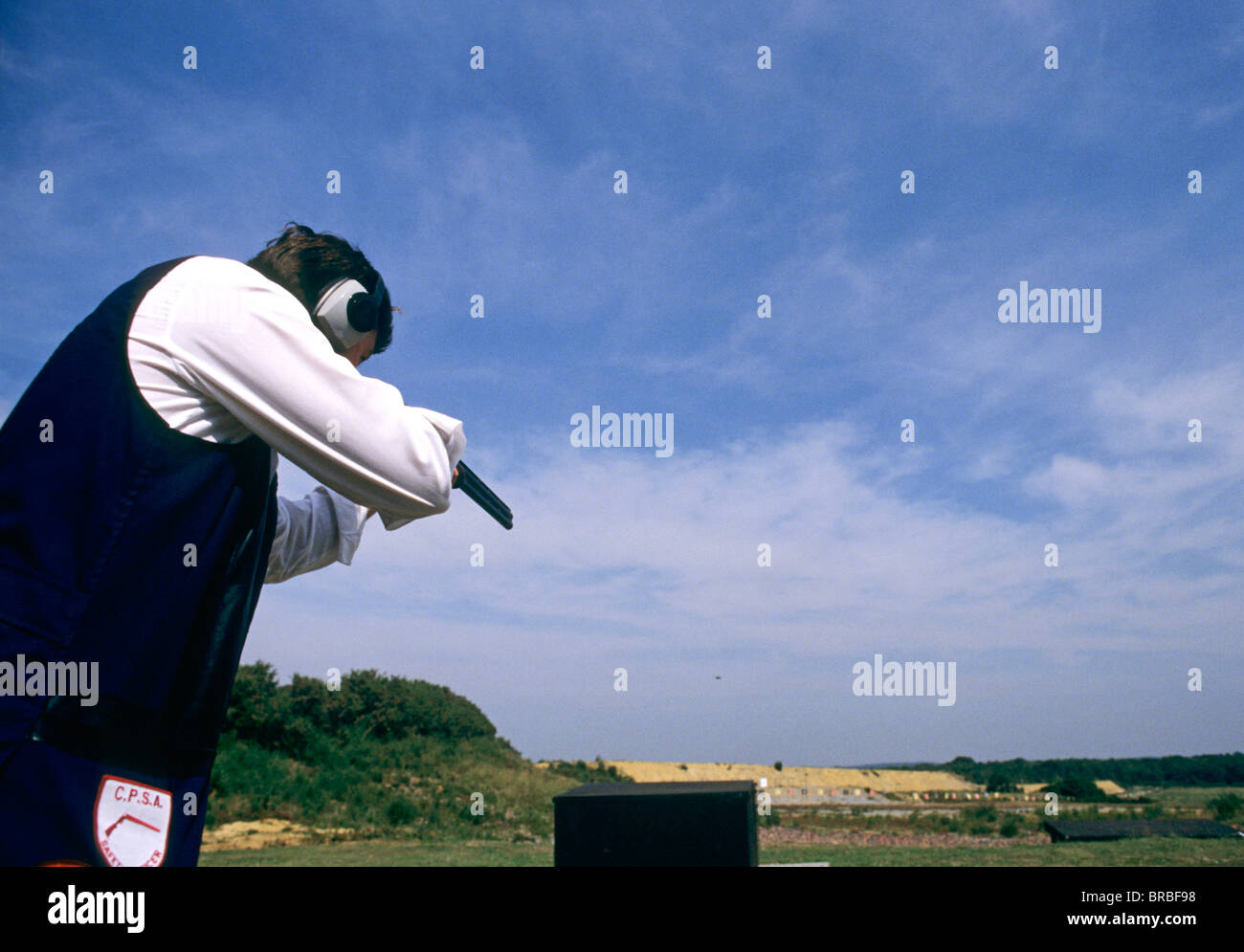 Man aiming gun at target Stock Photo - Alamy