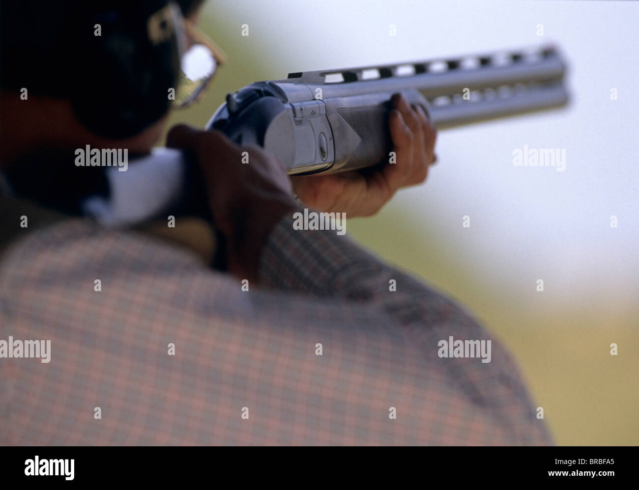 Man aiming gun Stock Photo - Alamy