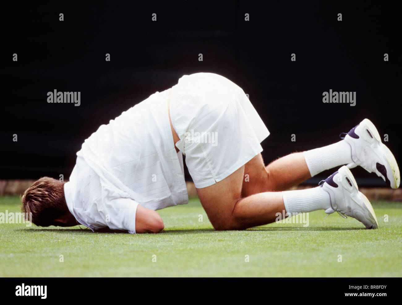 Tennis player falls on the court Stock Photo - Alamy
