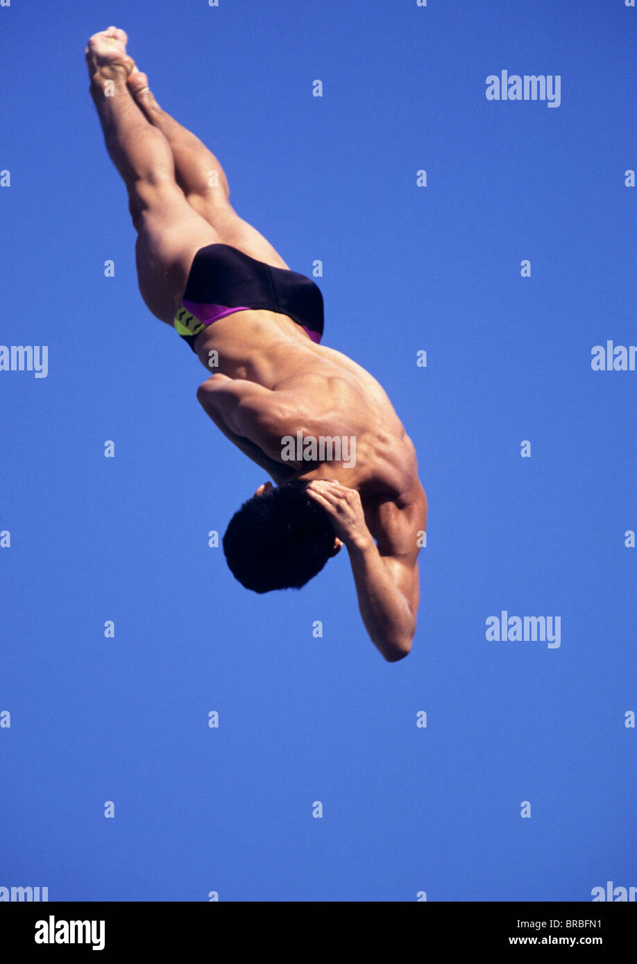 Man diving in midair Stock Photo - Alamy
