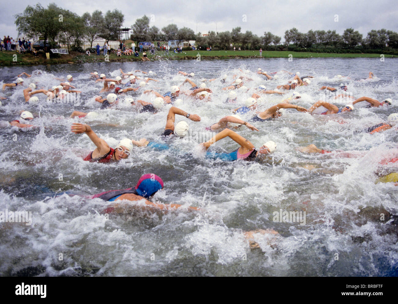 Group of swimmers in triathlon action Stock Photo - Alamy