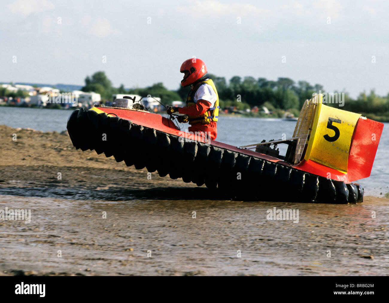 Racing hovercraft mounts the shores during racing hovercraft mounts the ...
