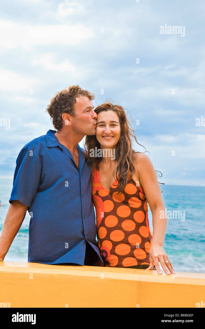 Portrait of smiling young couple close together outdoors hi-res stock ...