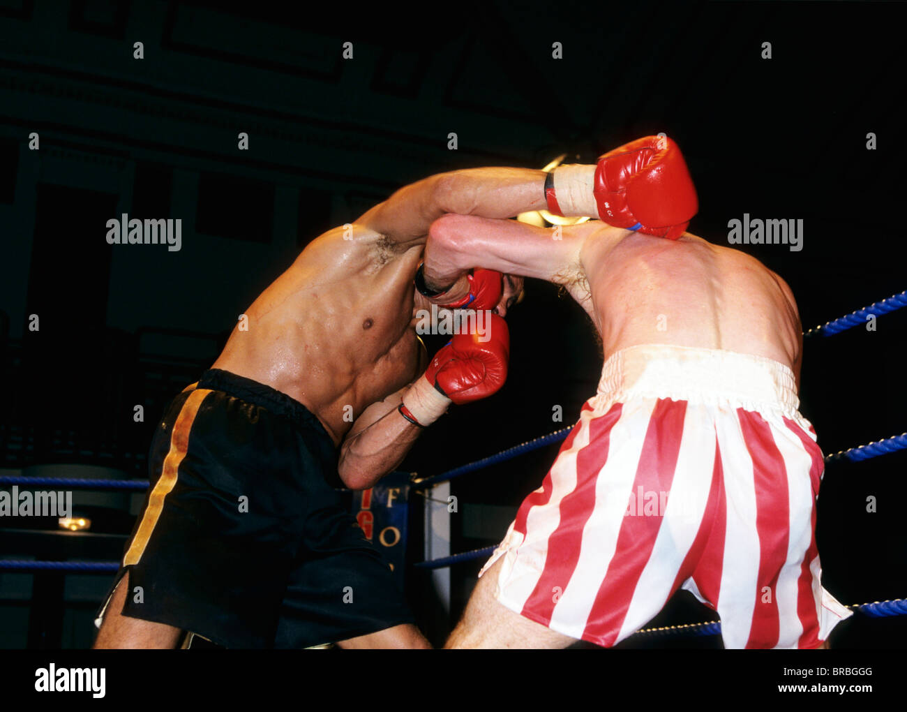 Two boxers exchange punches in ring Stock Photo - Alamy
