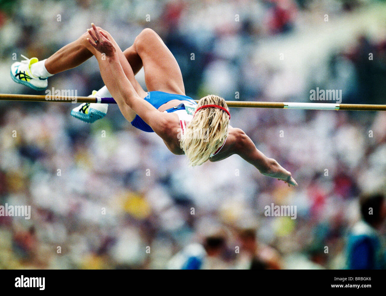 Female high-jumper clears bar on her jump Stock Photo - Alamy