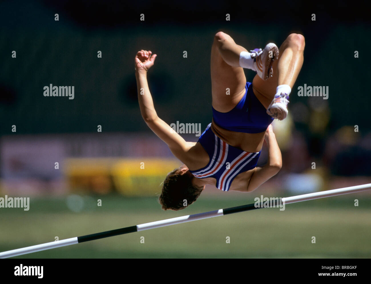 Female high-jumper knocks over bar on her jump Stock Photo - Alamy