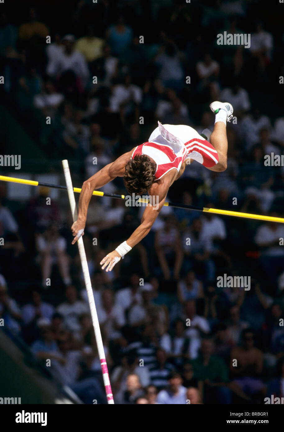 Man pole vaulting Stock Photo - Alamy