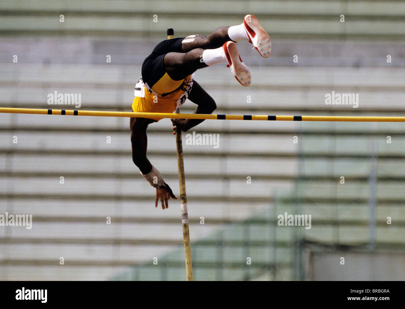 Man pole vaulting Stock Photo - Alamy