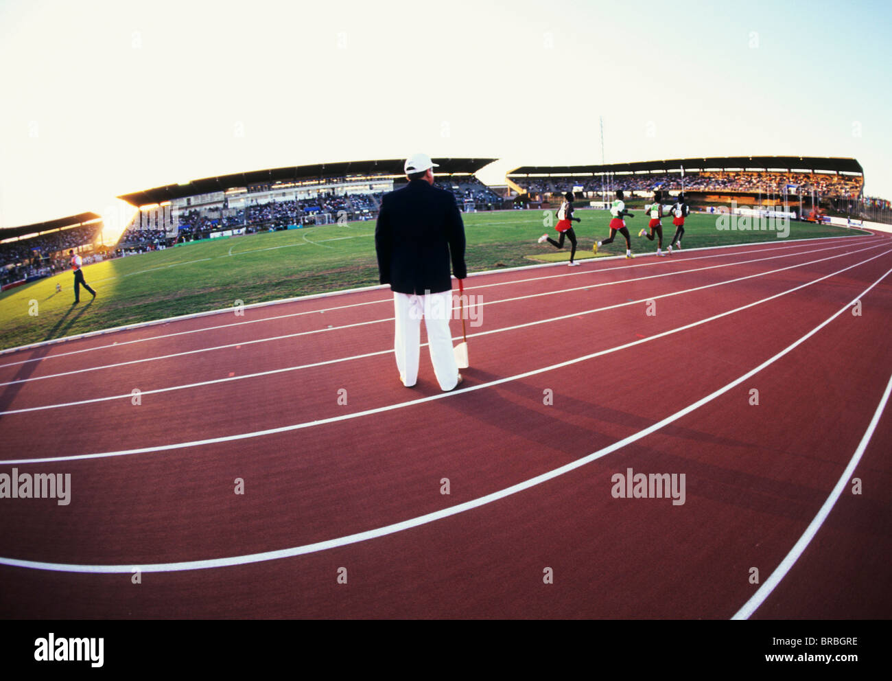 Track and field official watching runners Stock Photo - Alamy