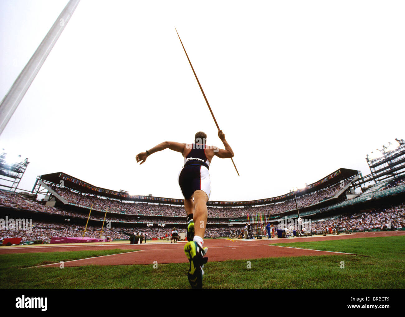 Man throwing a javelin Stock Photo - Alamy