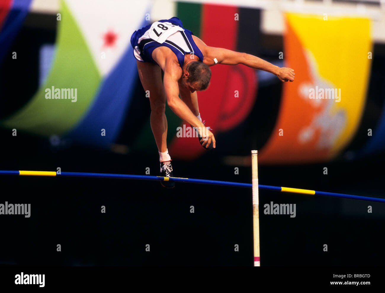 Man clears the bar pole vaulting Stock Photo - Alamy