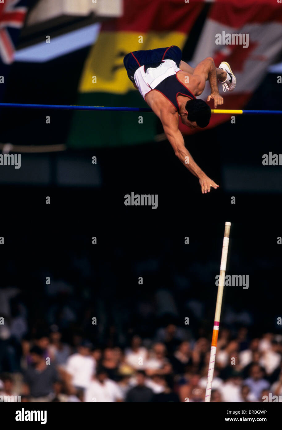 Man clears the bar pole vaulting Stock Photo - Alamy