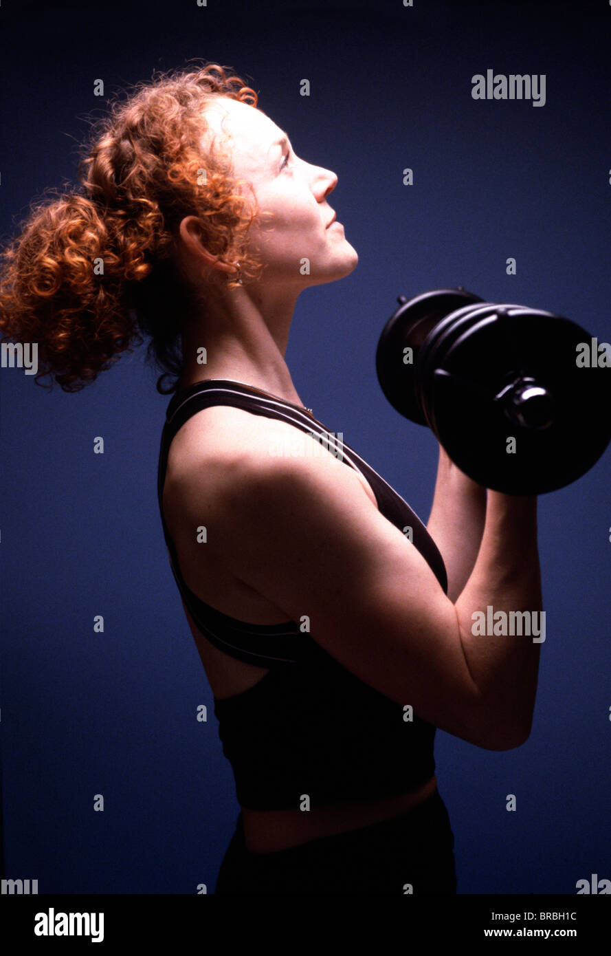 woman using hand weights Stock Photo - Alamy