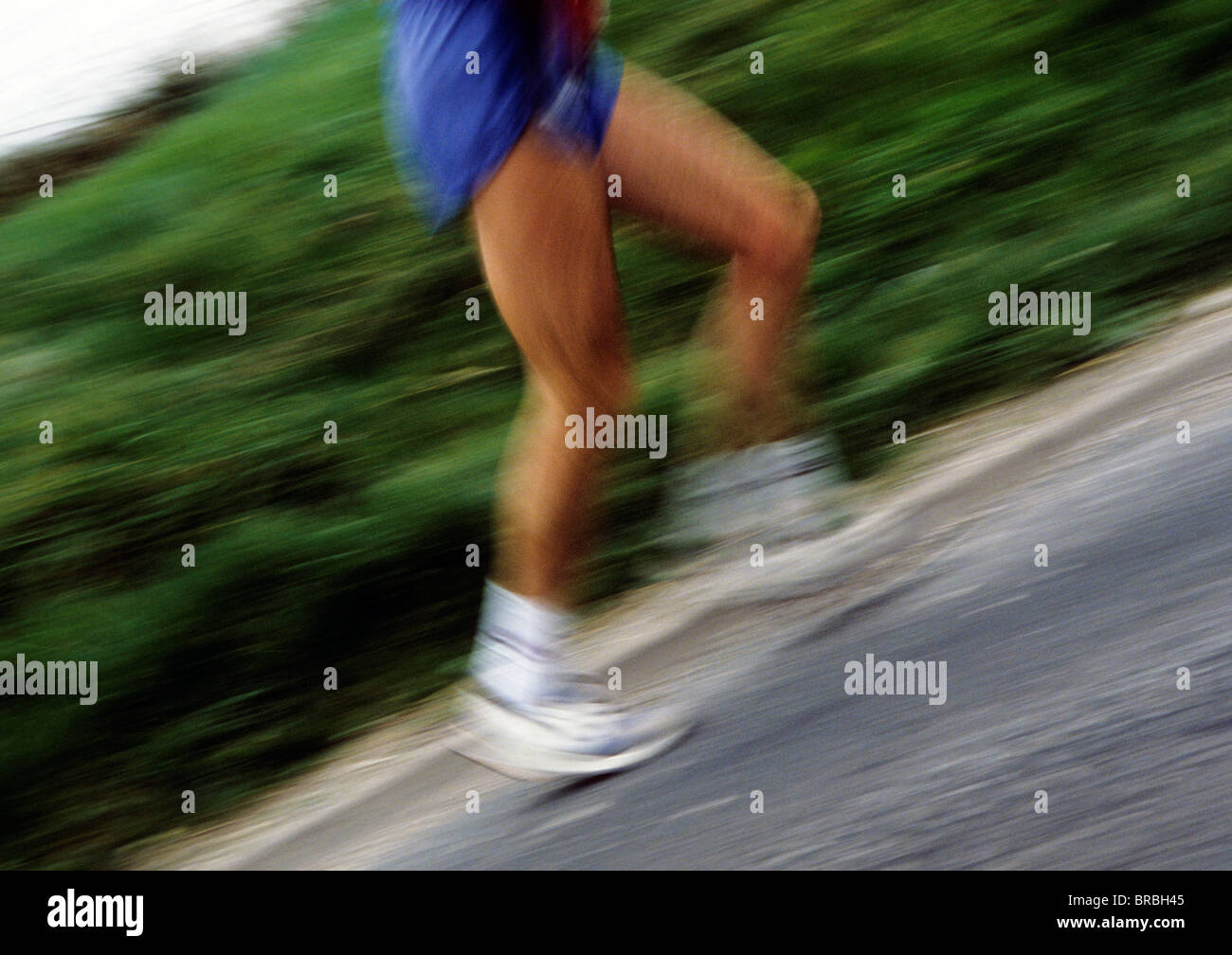 Runner in actionl Stock Photo - Alamy