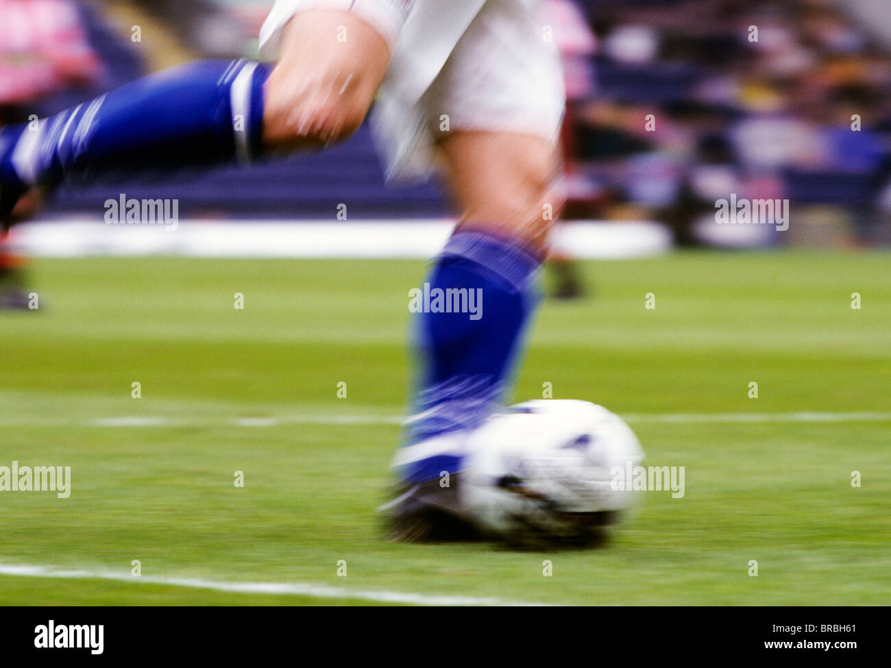 Football player running with the ball Stock Photo - Alamy