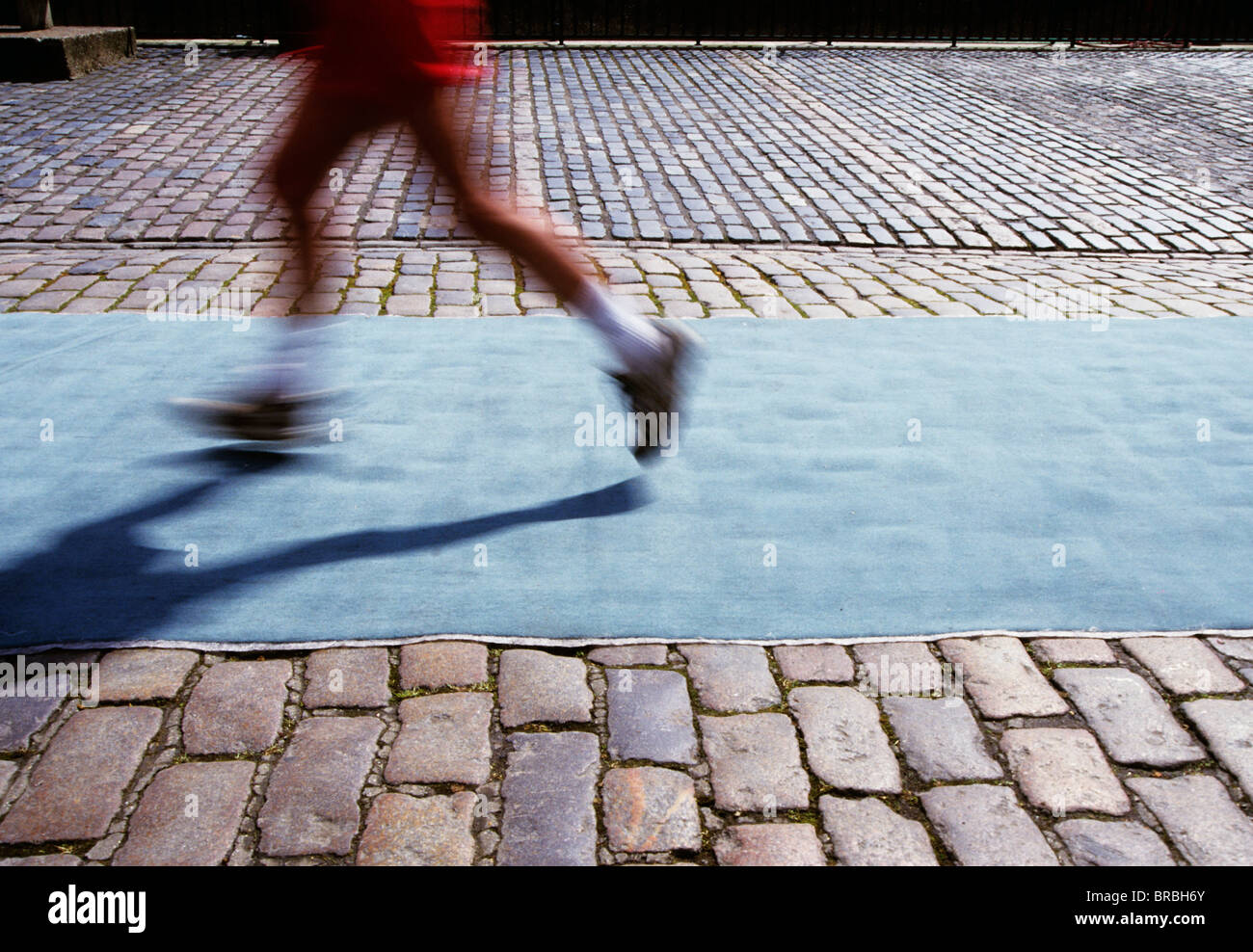Runner on a marked pathway Stock Photo - Alamy