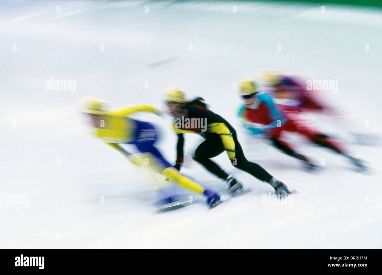 skaters on a short track racing in a blur Stock Photo - Alamy