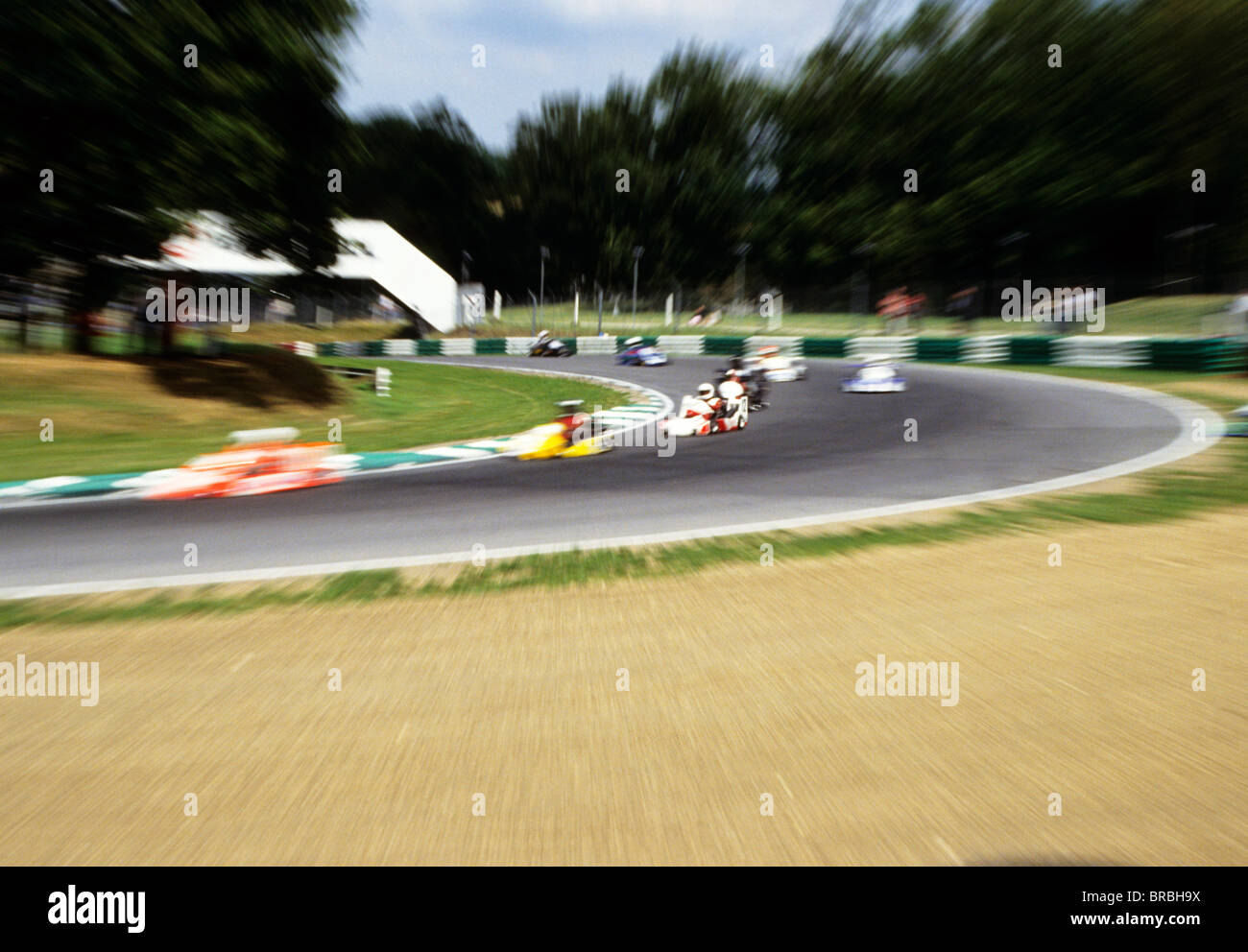 Blurred effect of formula go-karts in race at track Stock Photo - Alamy