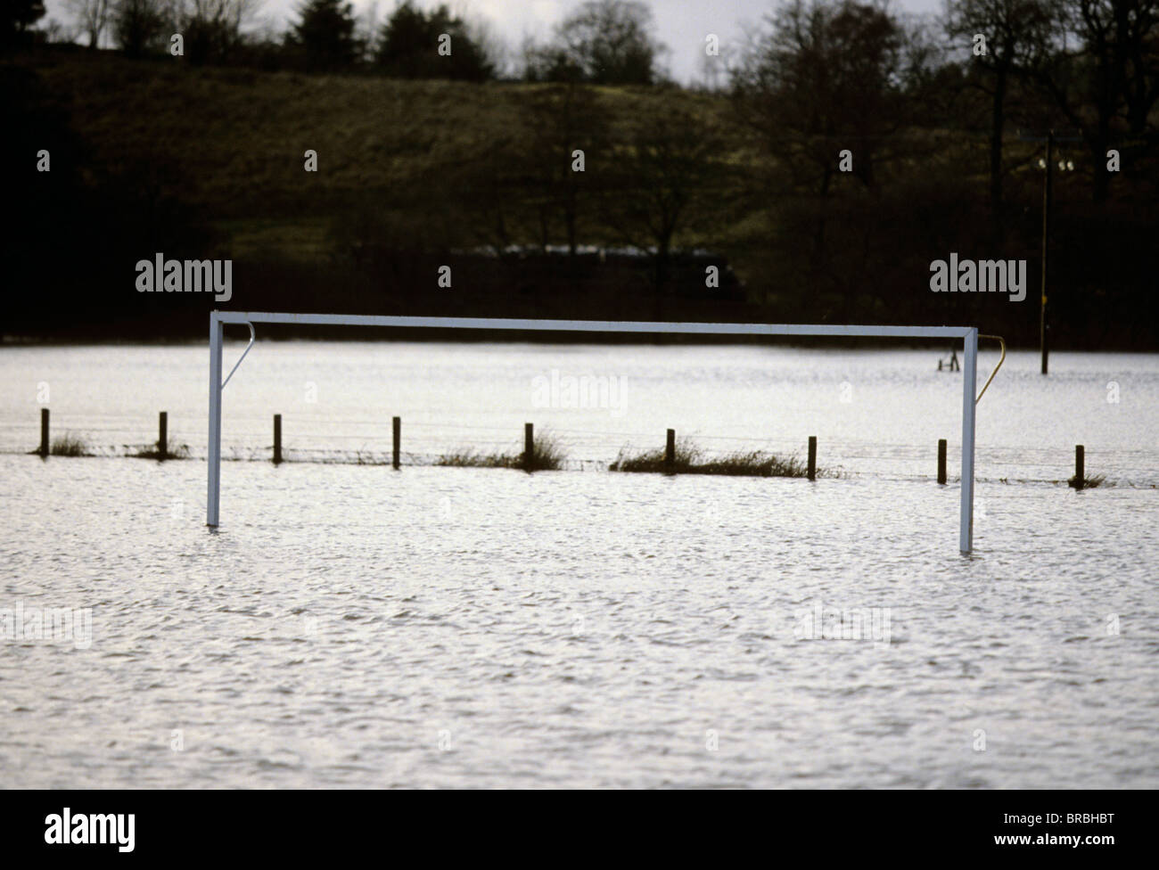 Flooded football field with fence in background Stock Photo - Alamy