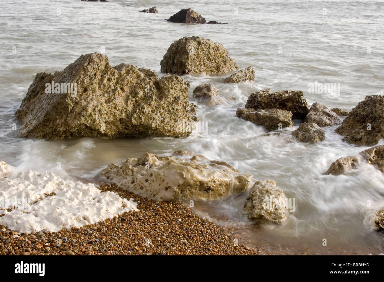 Rocks on the beach in the uk Stock Photo - Alamy