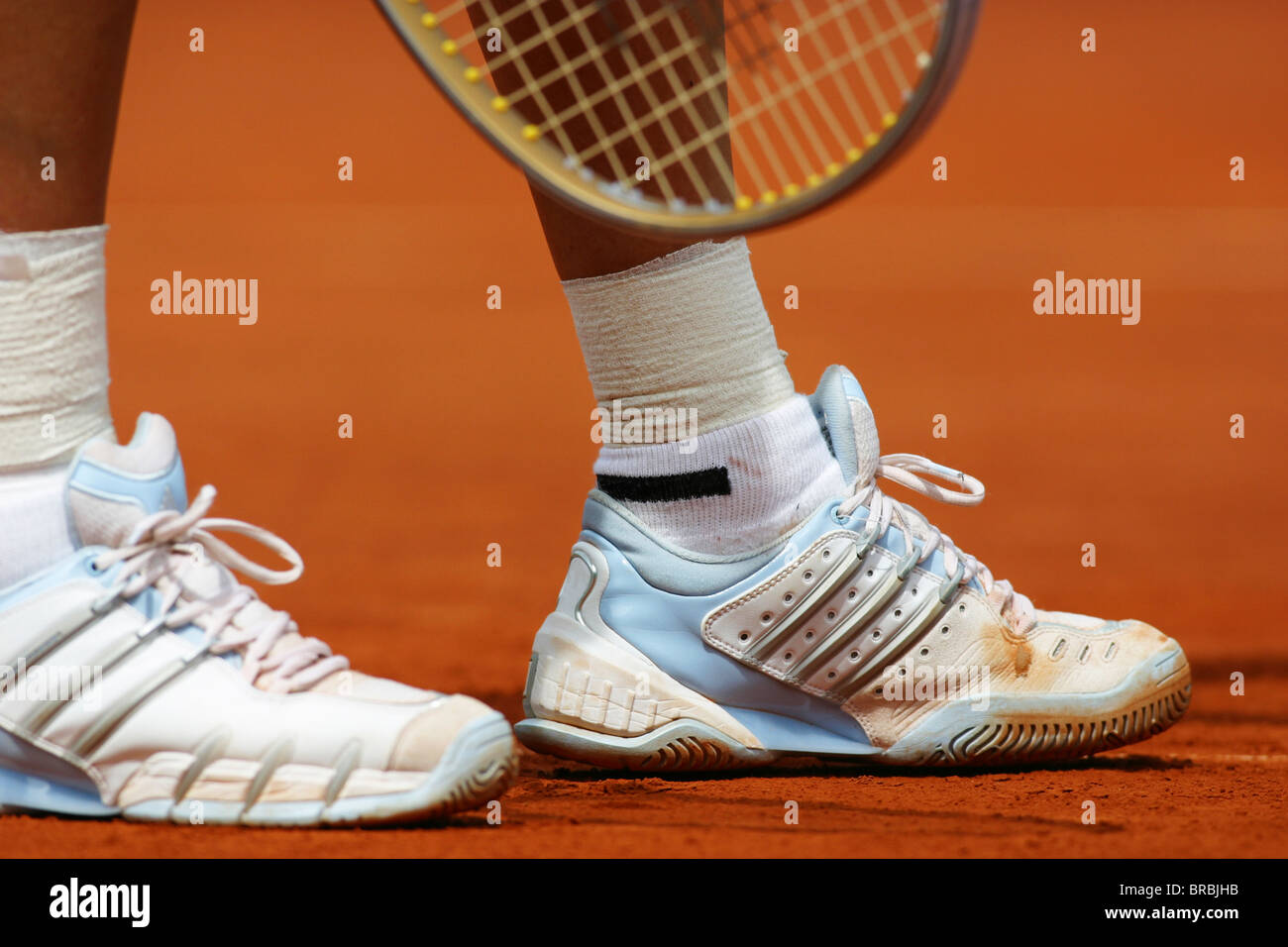 Tennis player on a clay court Stock Photo - Alamy