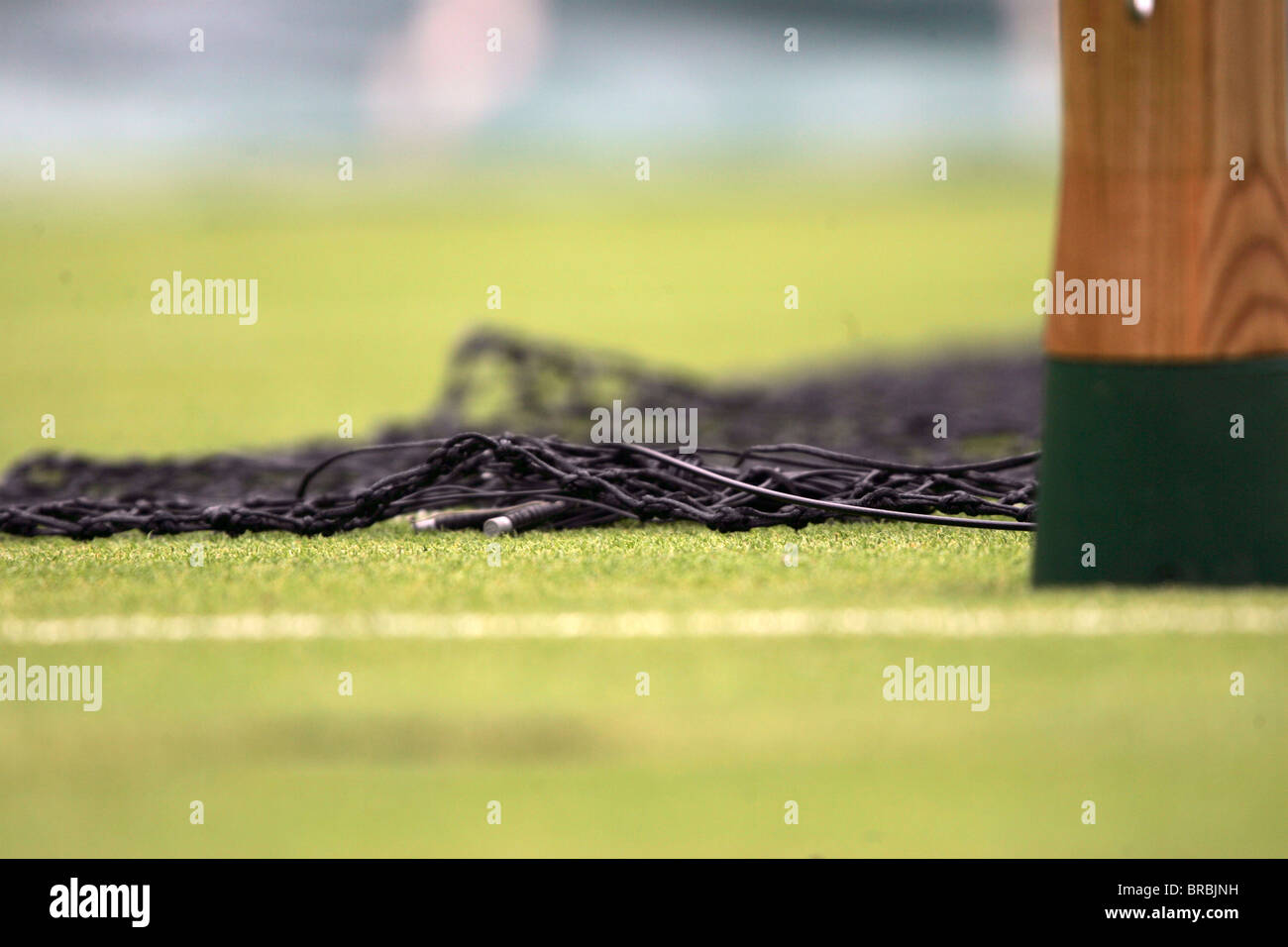 Tennis court net laying on the ground Stock Photo - Alamy