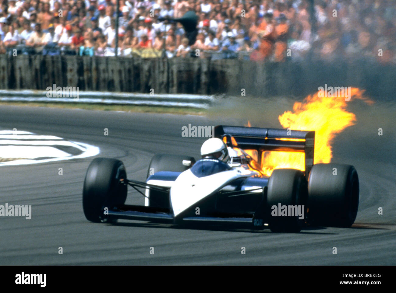 Race car driving on track with crowd hi-res stock photography and ...