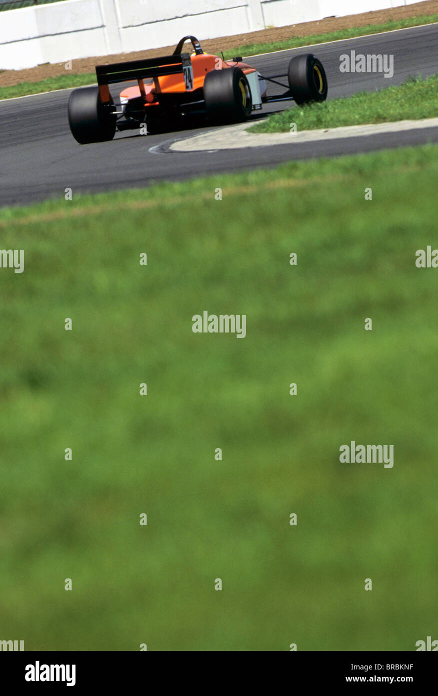 Formula one car driving around a corner Stock Photo - Alamy