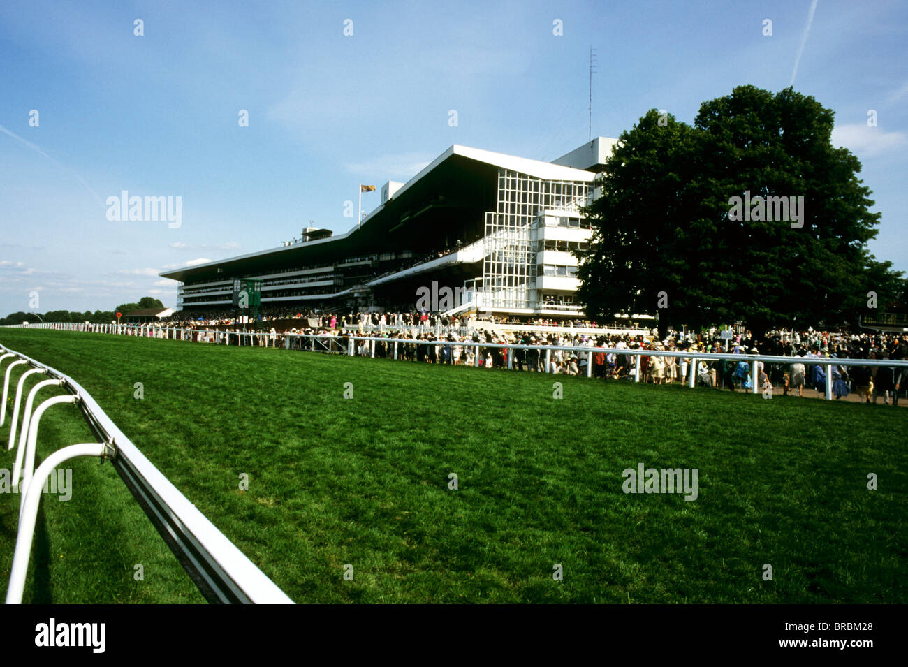 View of the grandstand at a racecourse from opposite side of railings ...