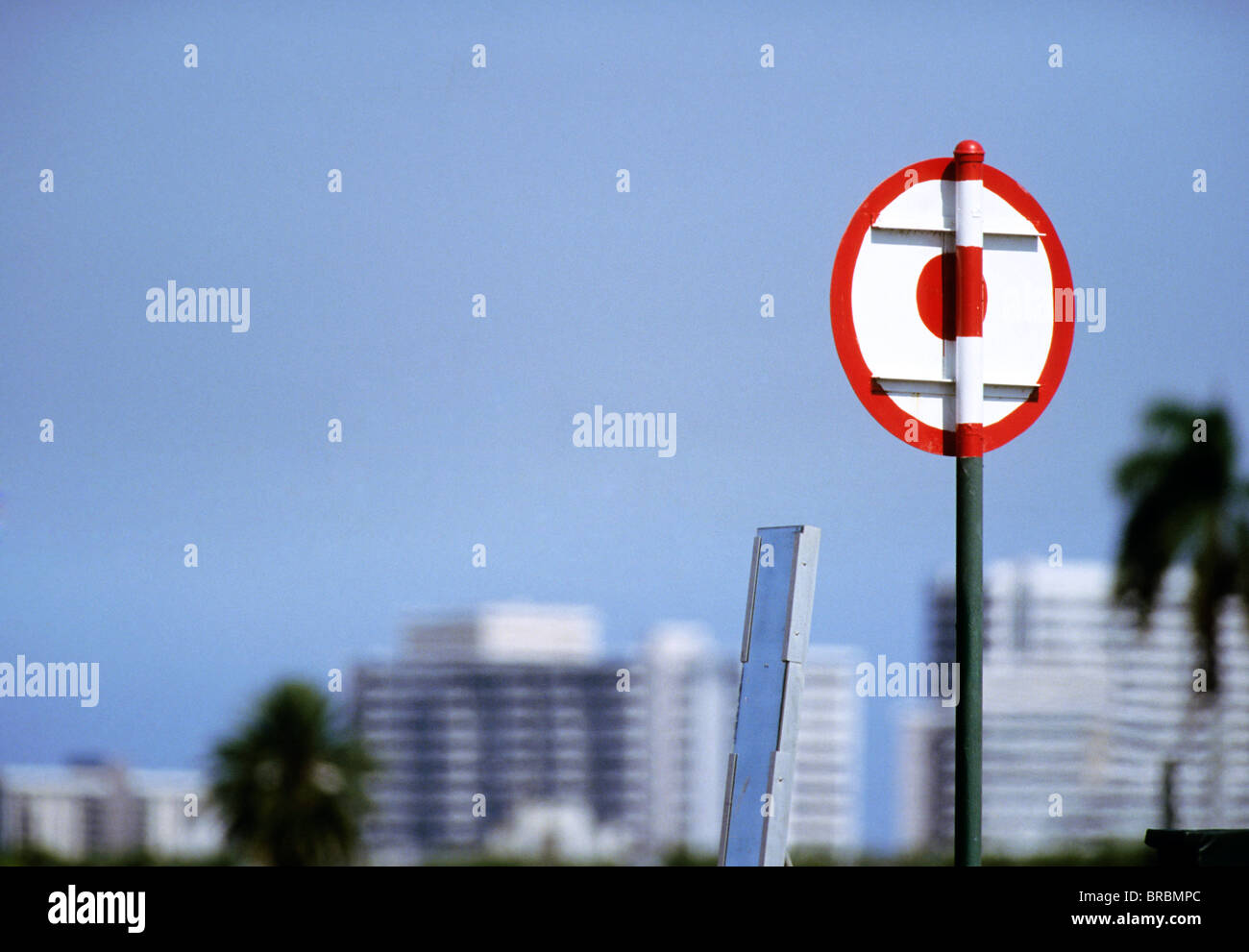 Horse racing furlong marker seen against city backdrop Stock Photo - Alamy