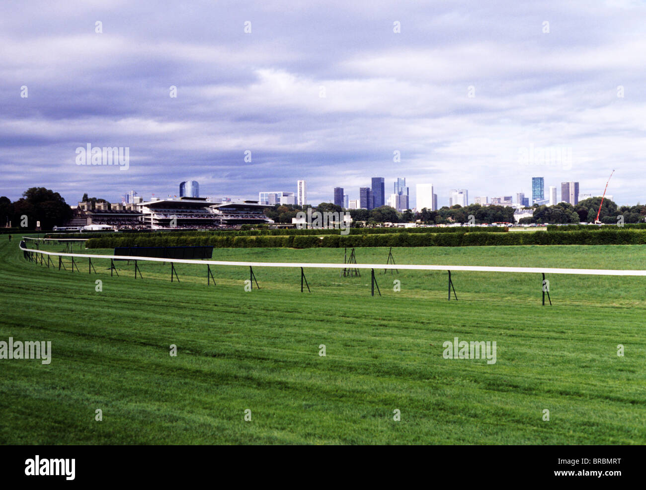 Grass horse racing track seen against backdrop of city-scape Stock ...