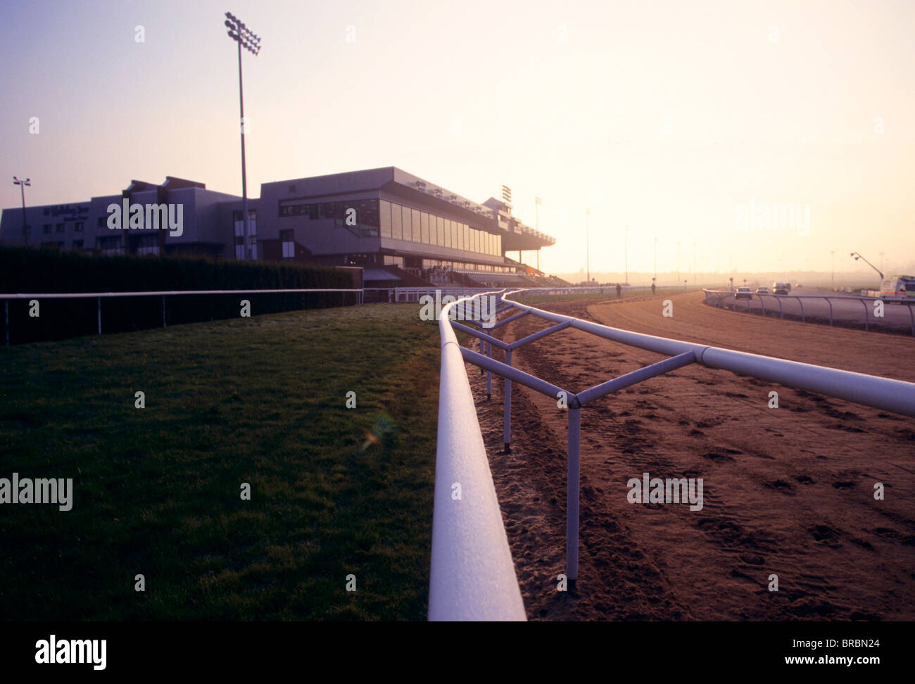 Railings alongside horse track at finish line Stock Photo - Alamy