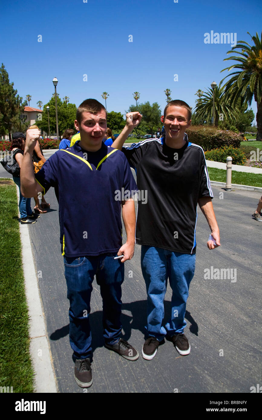 Two teenagers at a football game in Califonria with team shorts Stock ...