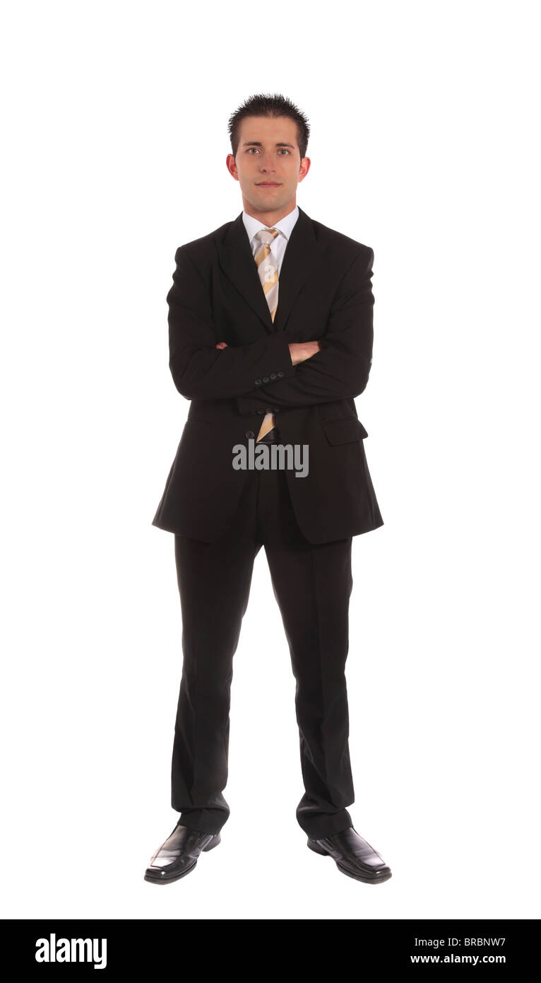 An aspiring businessman standing in front of a plain white background ...