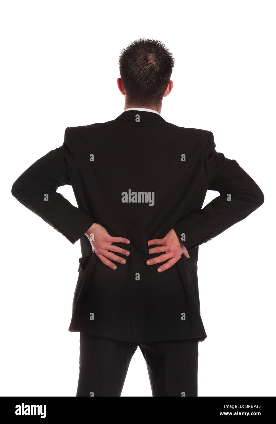A businessman suffering from backache. All on white background Stock ...